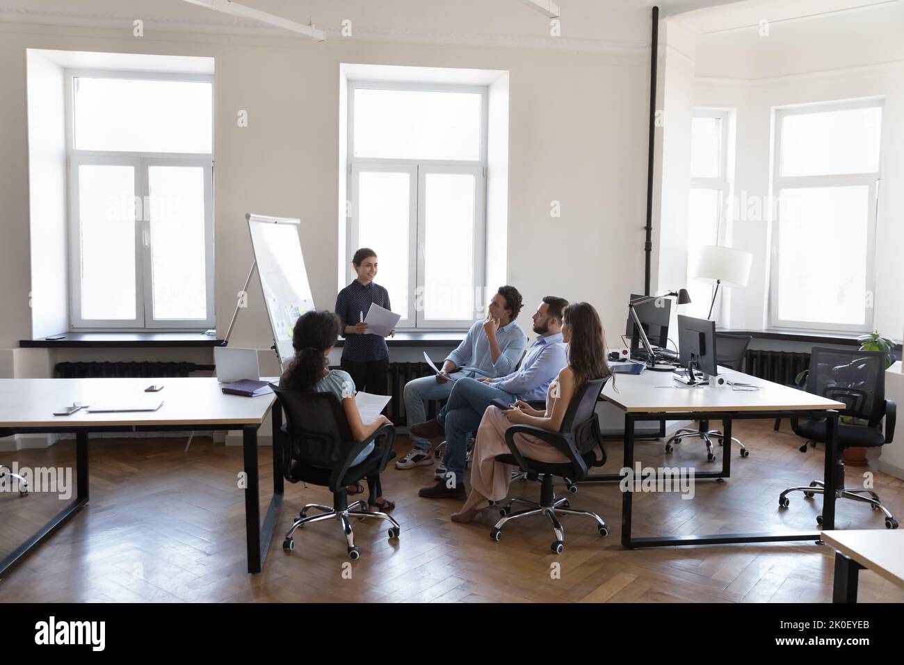 Presenter woman training diverse group of employees Stock Photo - Alamy