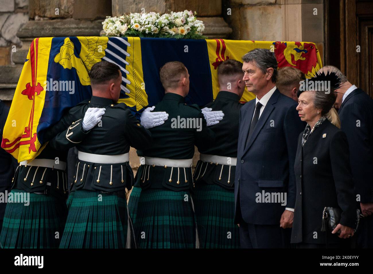 Vice Admiral Timothy Laurence and the Princess Royal stand solemnly as ...