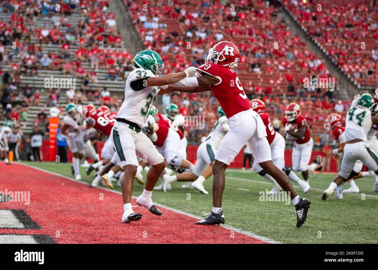 Chris Long (9 Rutgers) holding up a player during the Big Ten ...