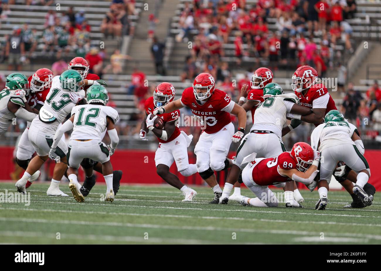 Kyle Monangai (23 Rutgers) trying to pass through the defense during ...
