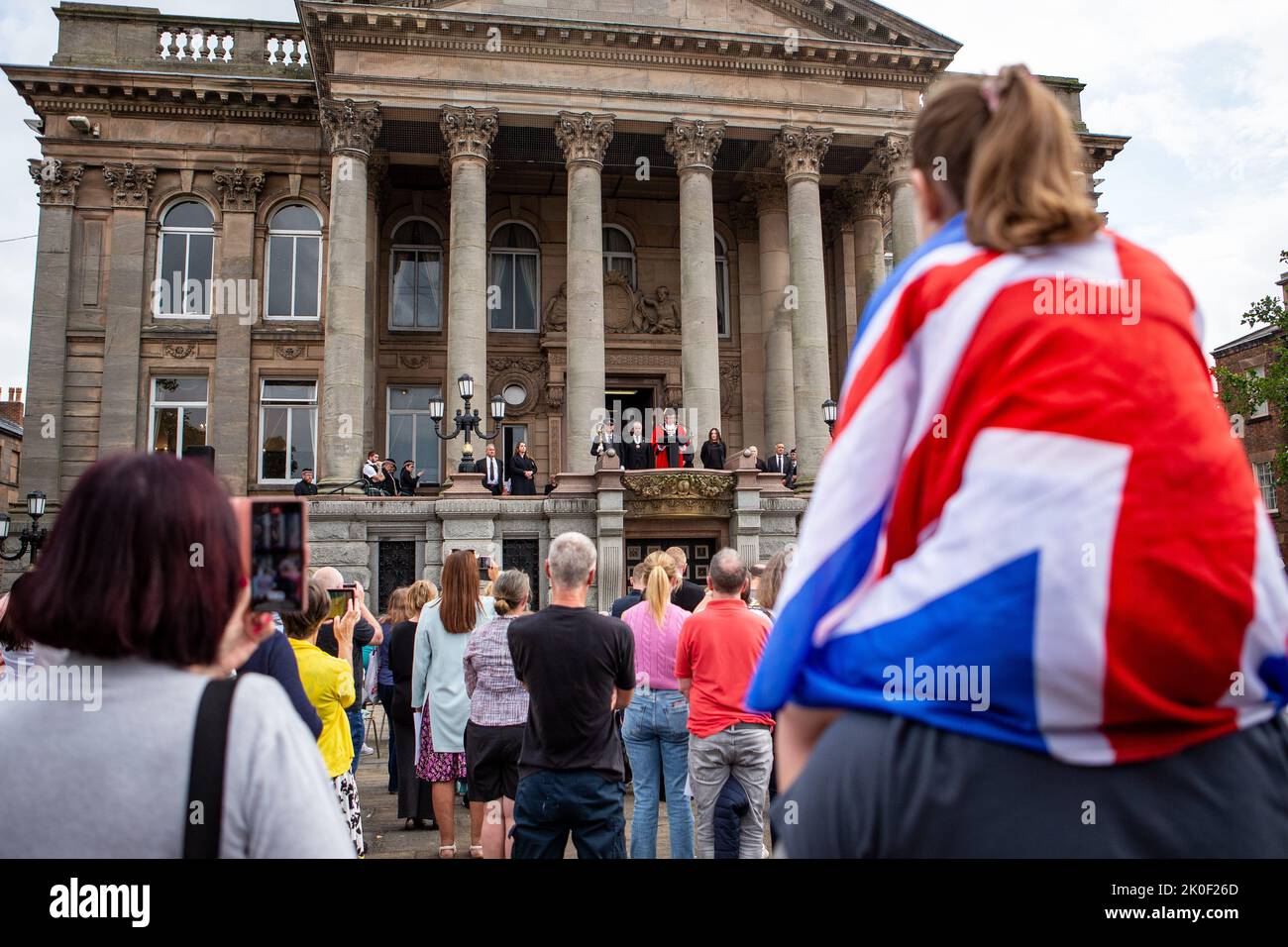 A young girl draped in a Great Britain flag watches on as Mayor of ...