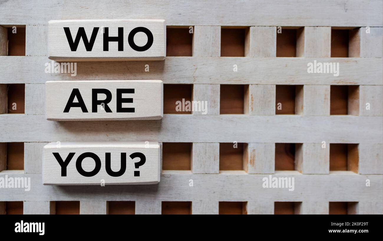 Who are you, question written on wooden blocks and vintage background ...
