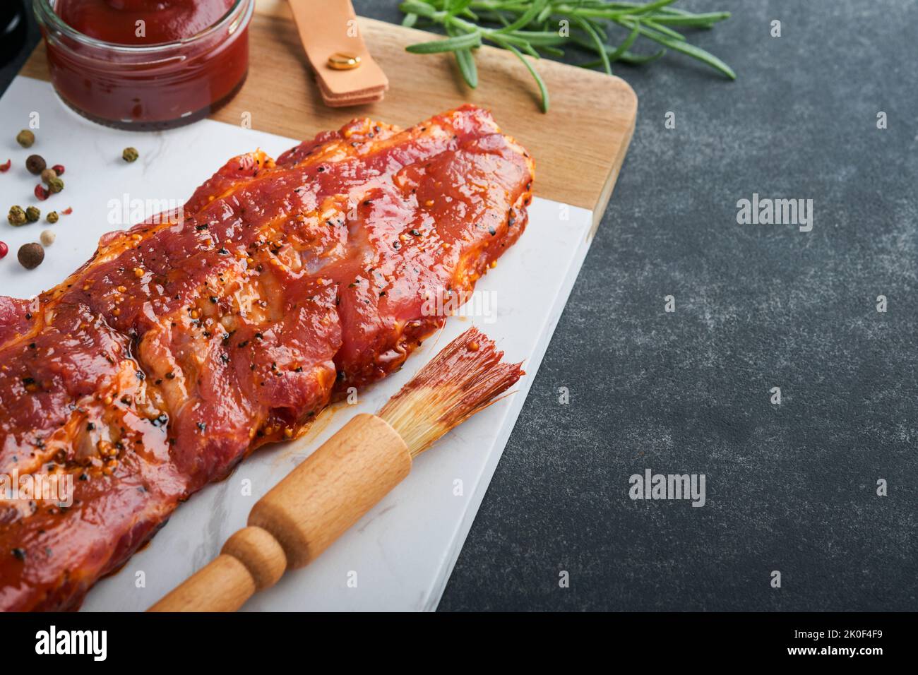 Pork ribs. Raw meat. Raw pork ribs in marinade with spices, rosemary ...