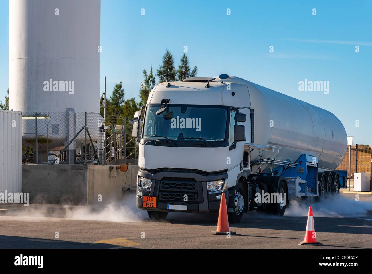 Unloading of a tanker truck with gas, creating a cloud due to ...