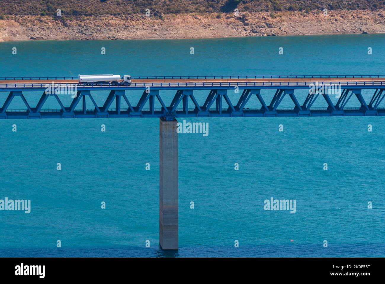 Fuel tanker truck driving over a bridge Stock Photo - Alamy