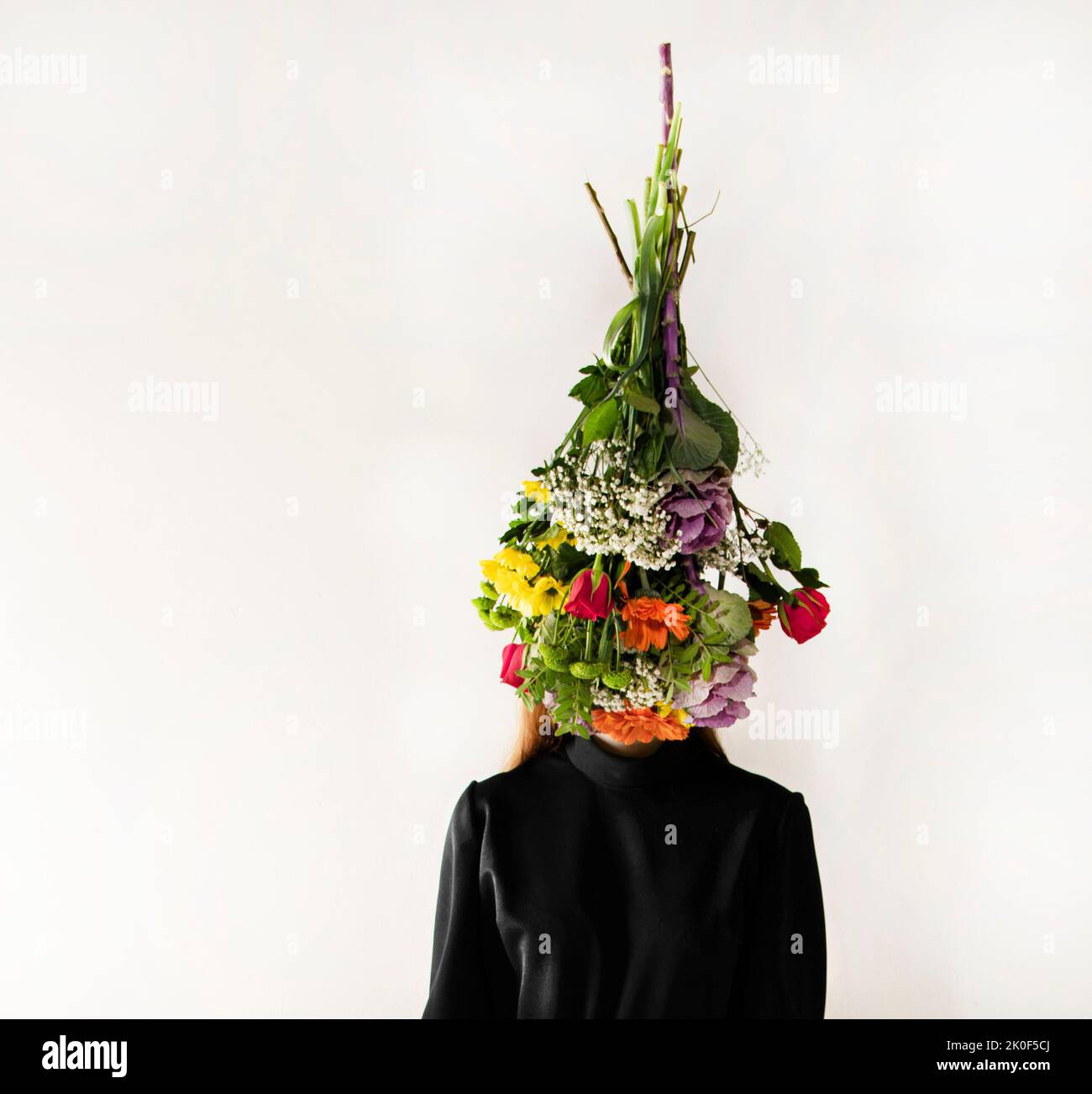Upside down bouquet of flowers replacing the girls head Stock Photo - Alamy