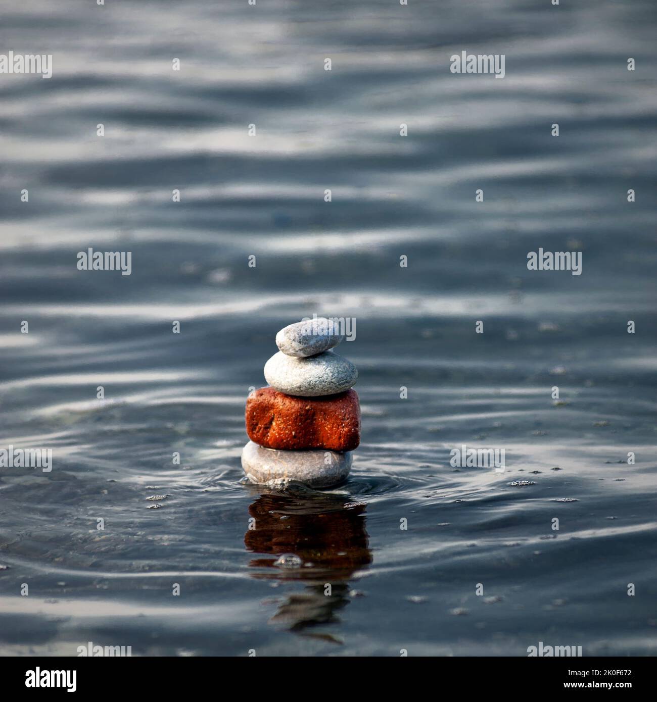 Balanced rock pyramid on sea hi-res stock photography and images - Alamy