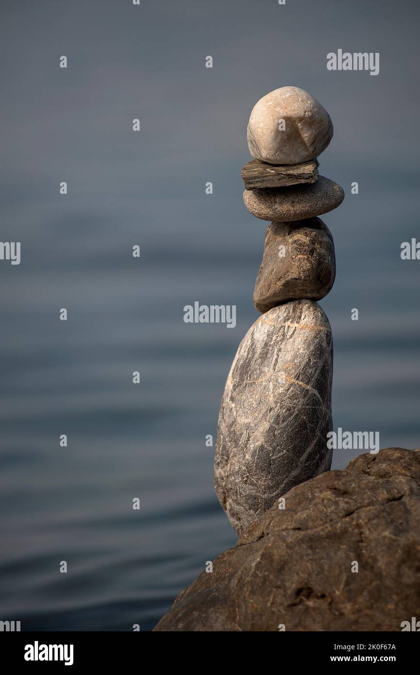 balanced stones on the rocks of the sea Stock Photo - Alamy