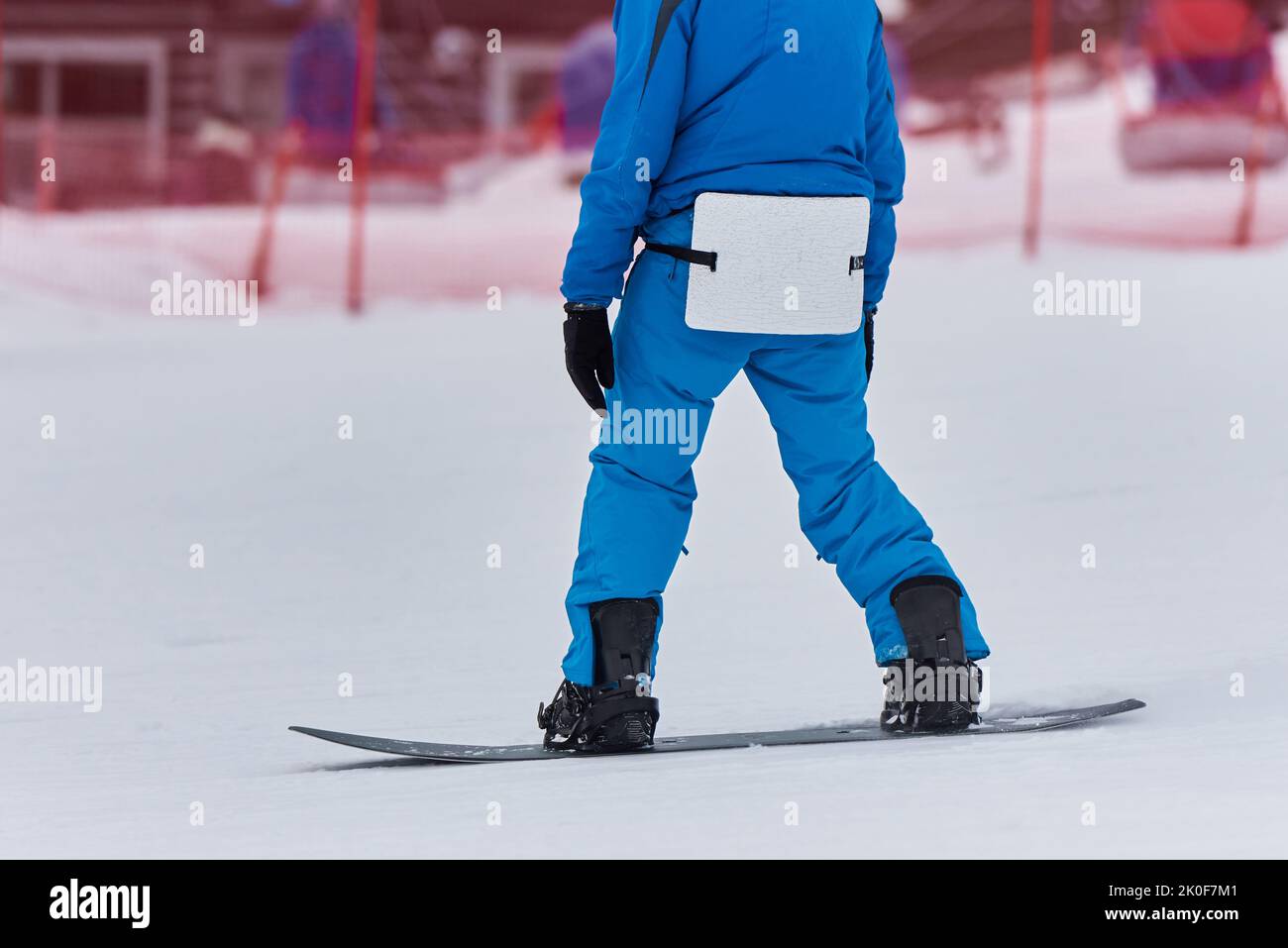 Snowboarder using spine protection while skiing for safety Stock Photo ...