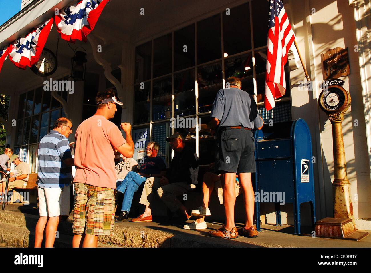 A group of friends gather on the front porch of the Brewster General ...