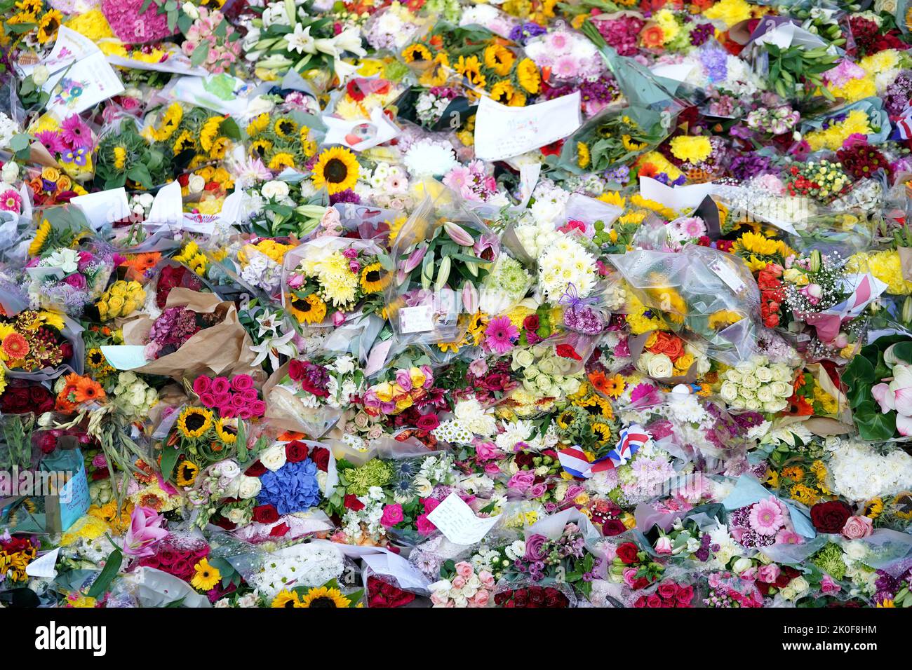 Piles of flowers can be seen at Buckingham Palace, London, following ...