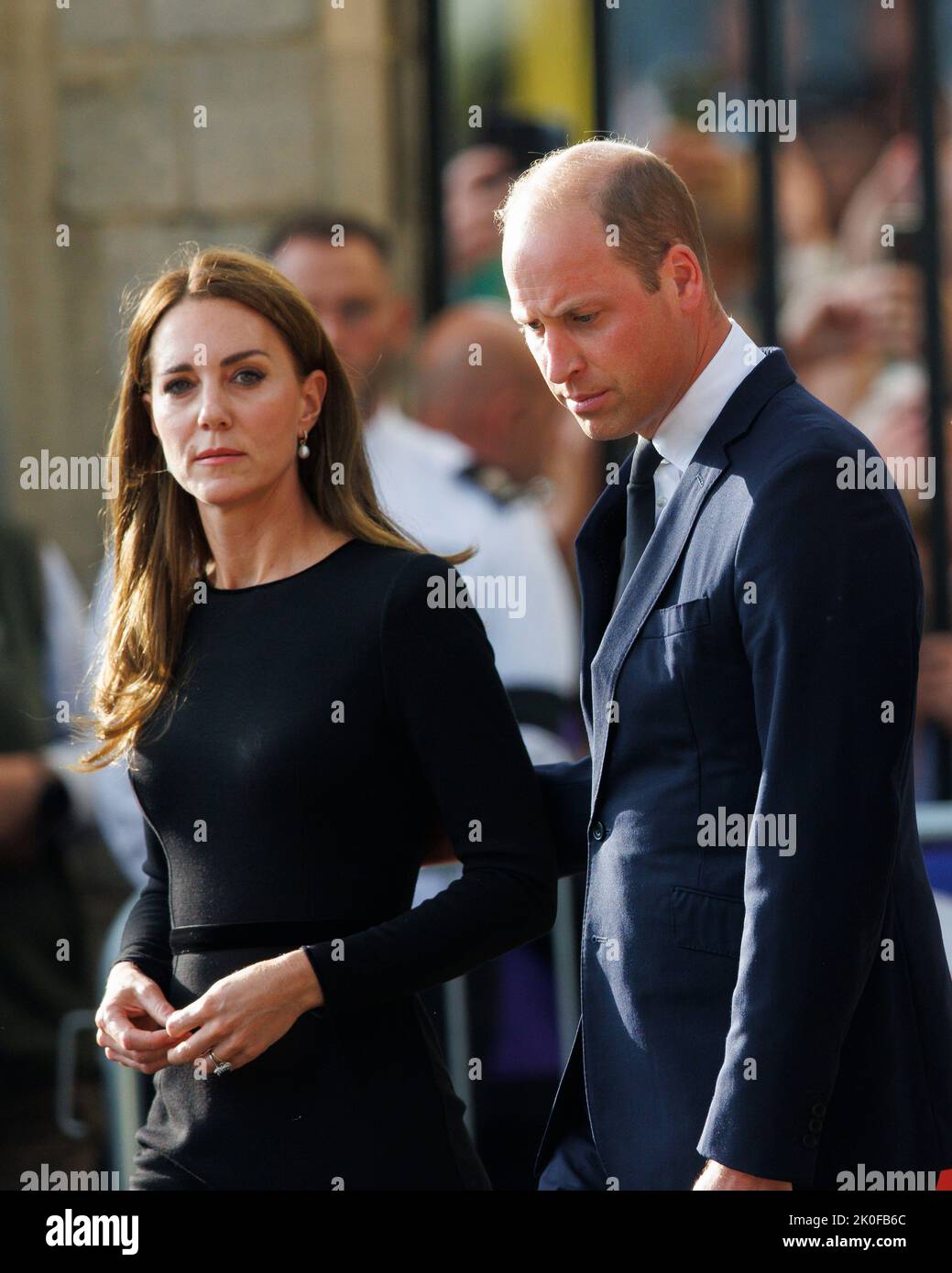 William Prince of Wales and Catherine Princess of Wales look at flowers ...