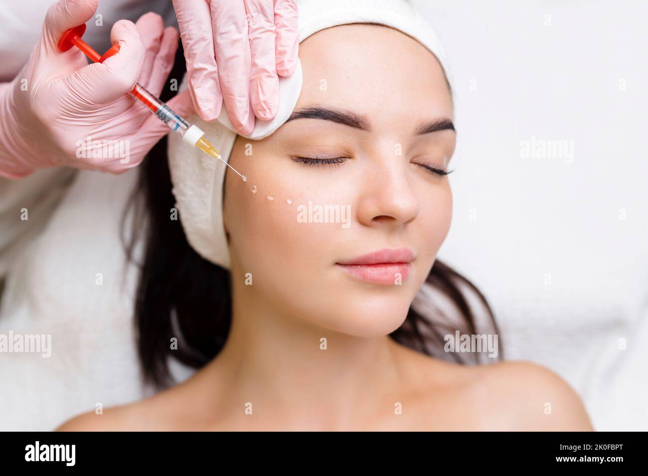 Cosmetologist Makes Rejuvenating Anti Wrinkle Injections On The Face Of