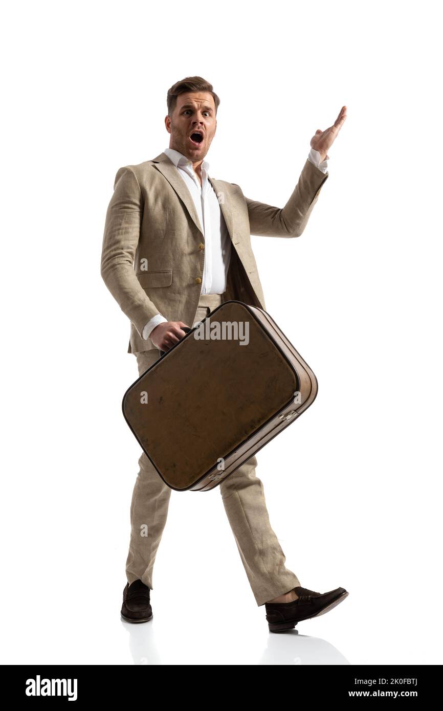 upset businessman with luggage getting angry for his flight delay ...