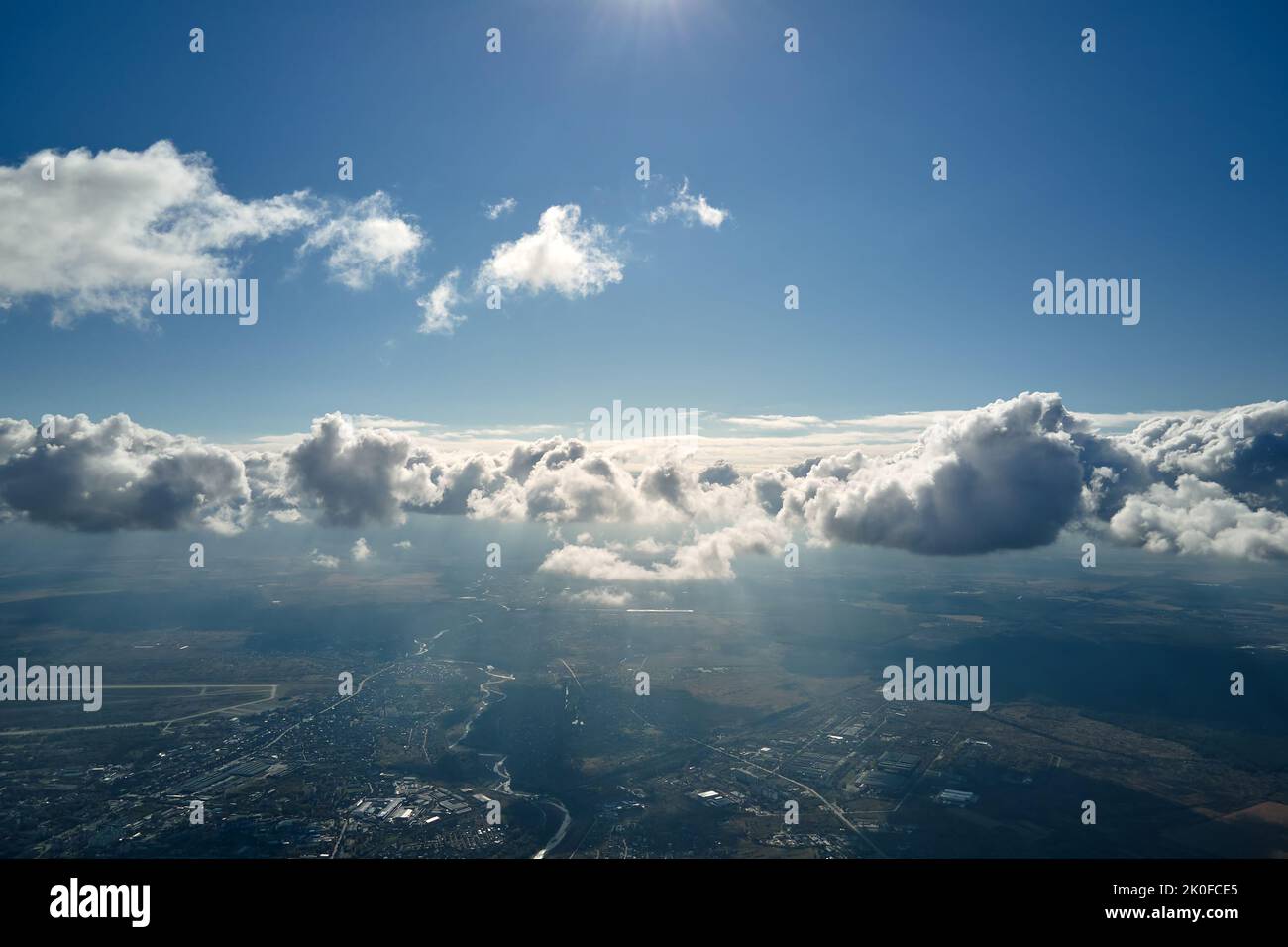 Aerial view from airplane window at high altitude of earth covered with ...