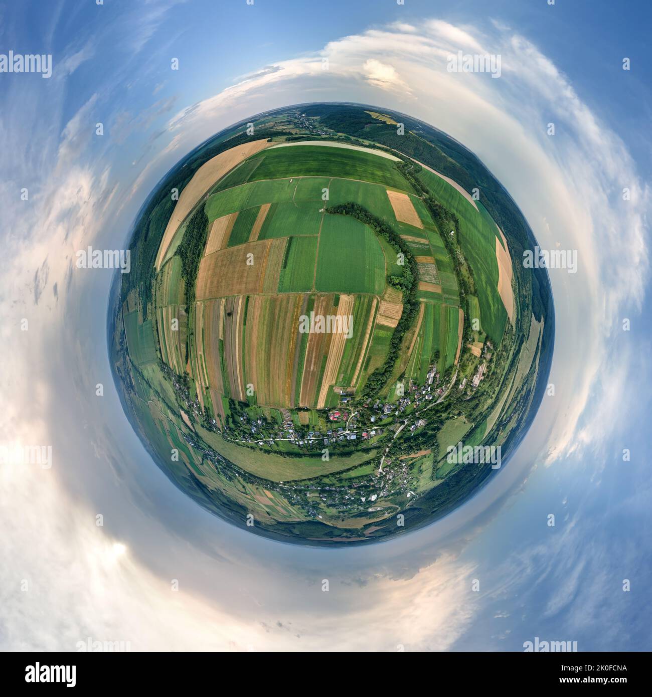 Aerial view from high altitude of little planet earth with green and ...