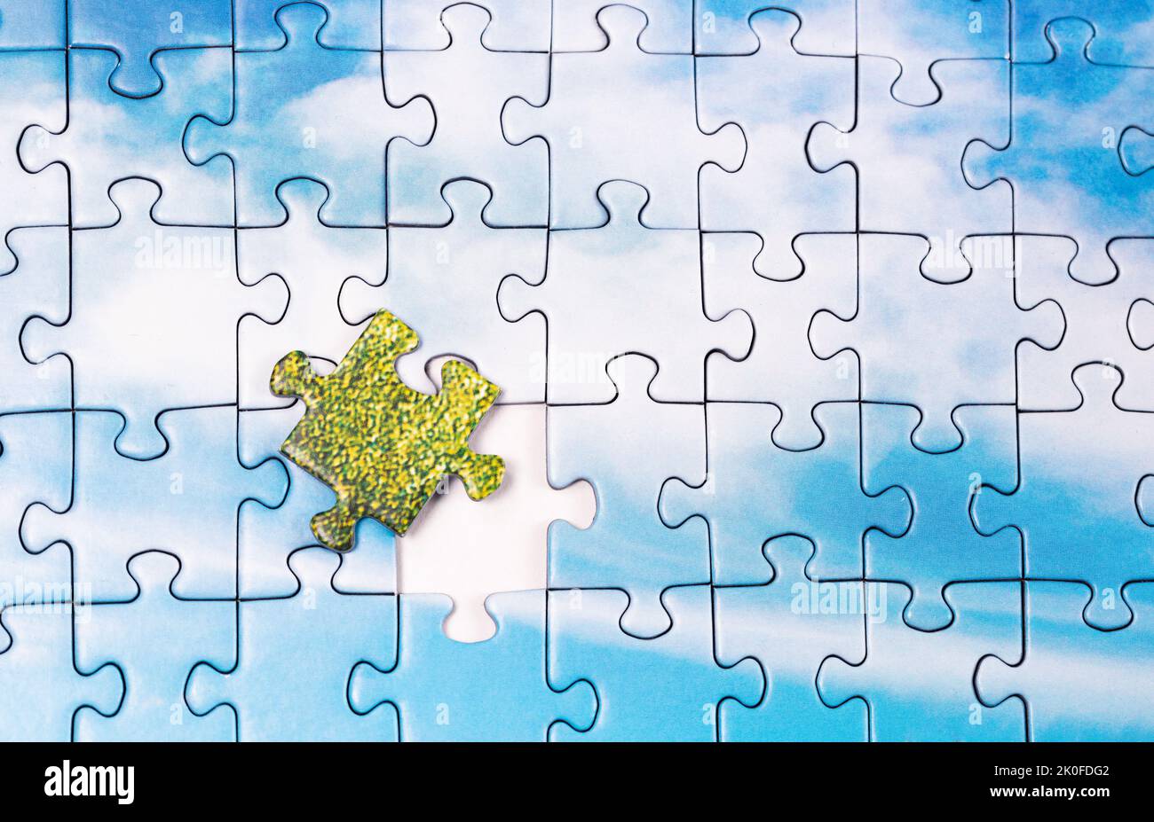 Puzzle. Piece of a puzzle with many pieces. The concept of a whole made ...