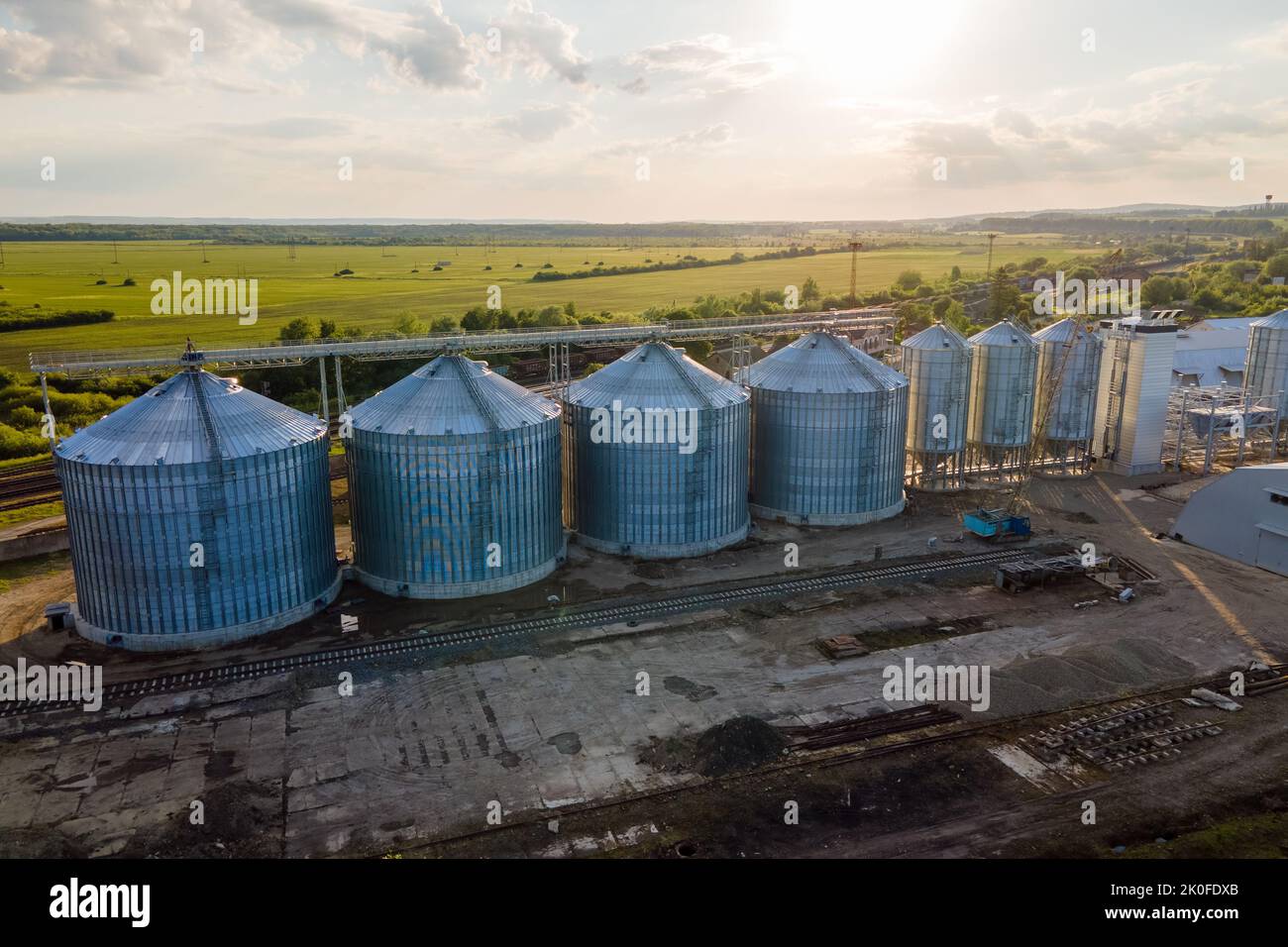 Aerial view of industrial ventilated silos for long term storage of grain and oilseed. Metal ...