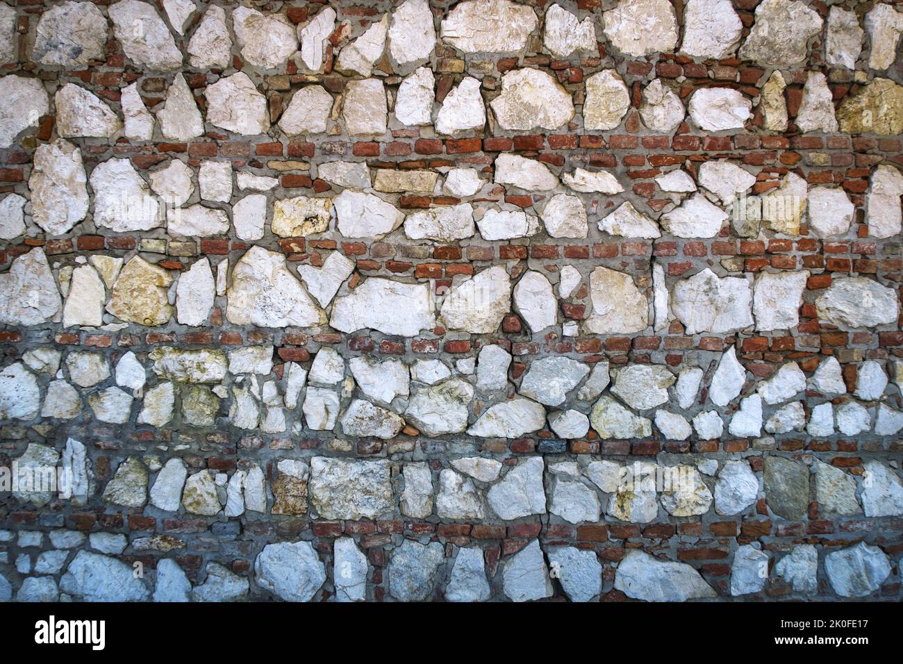 background or texture wall with combined building material Stock Photo ...