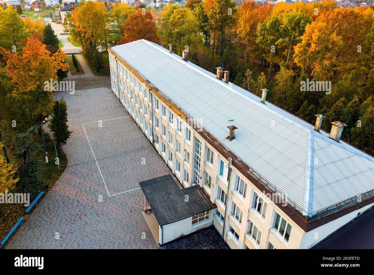 Aerial view of school, college or kindergarten building with big yard ...