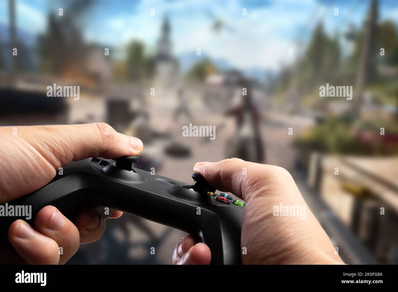 GAM22ICB joystick in the hands of a gamer on the background of a video ...