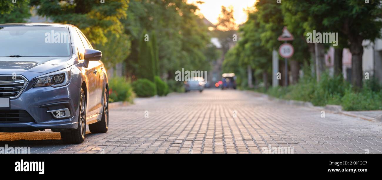 Close up of a car parked on city street side. Urban traffic concept ...