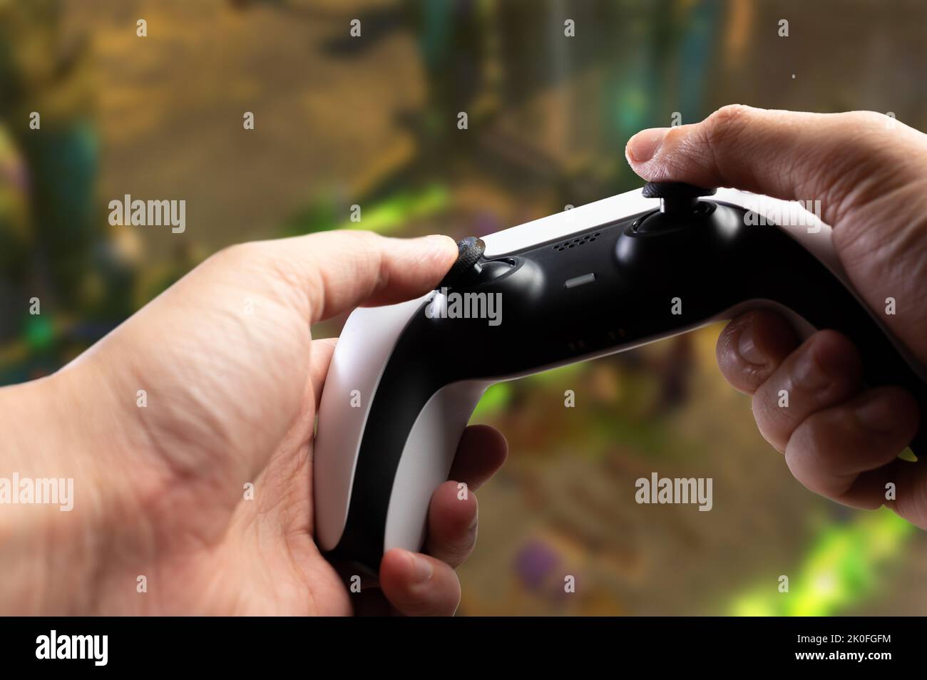 Joystick GAM22ICB on the background of a video game on a large TV ...