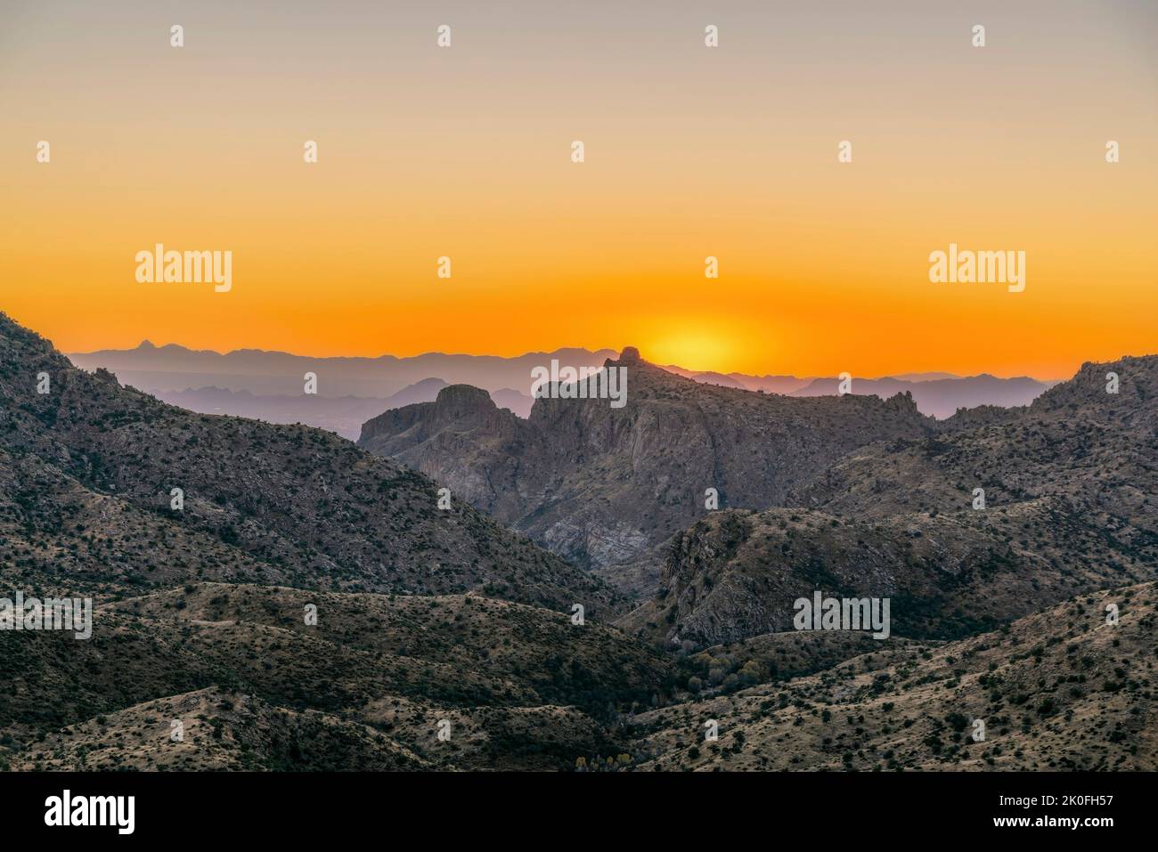 Scenic Santa Catalina mountain range with golden sky in the horizon at ...