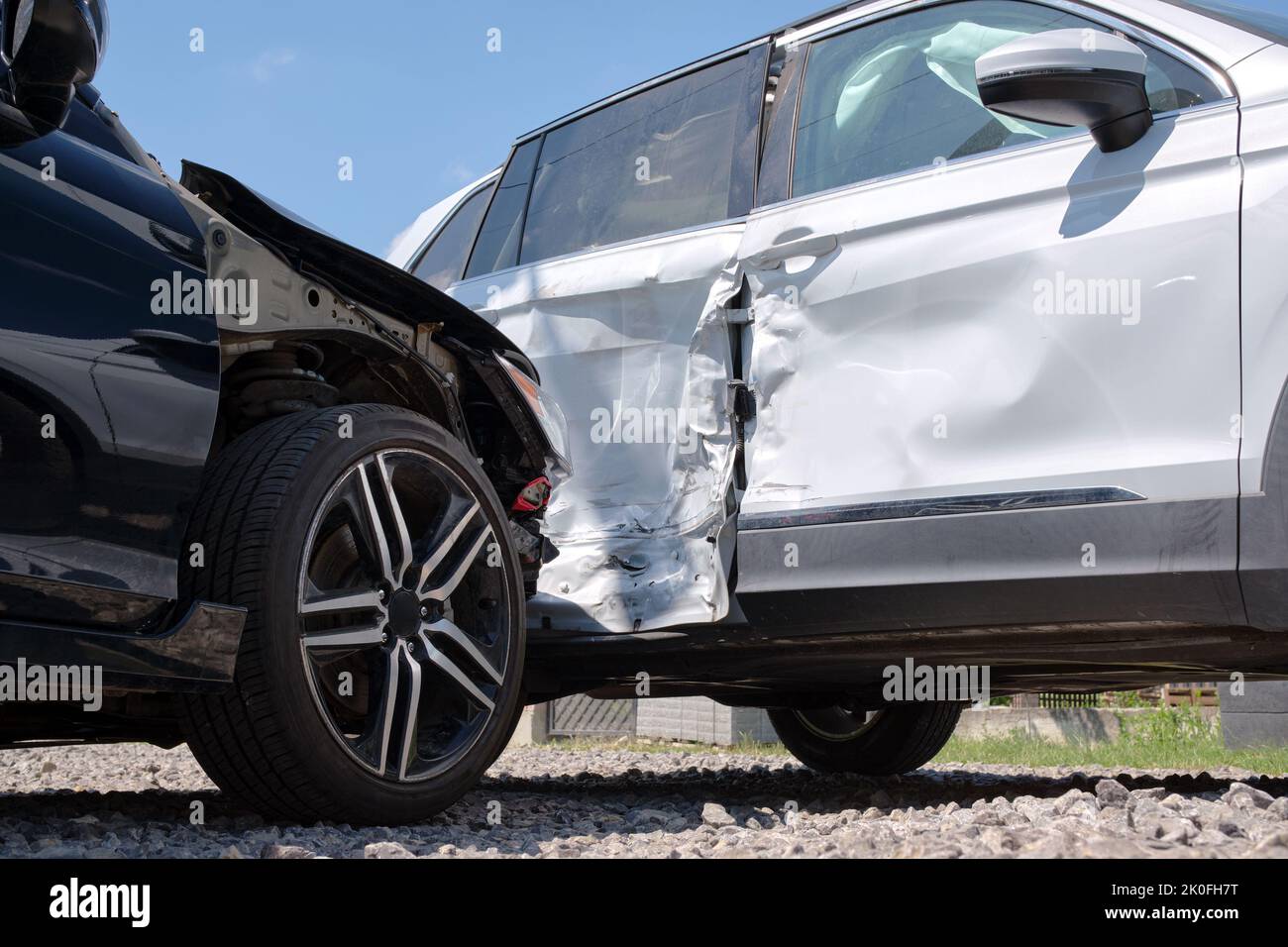 Damaged in heavy car accident vehicles after collision on city street ...
