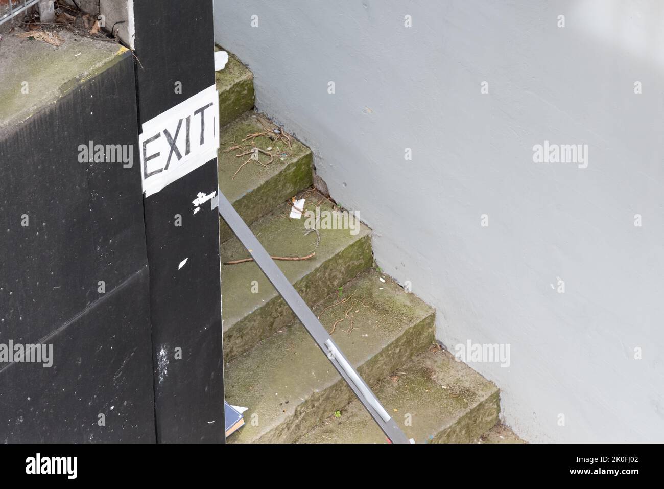 Exit handwritten in block letters on a staircase Stock Photo - Alamy