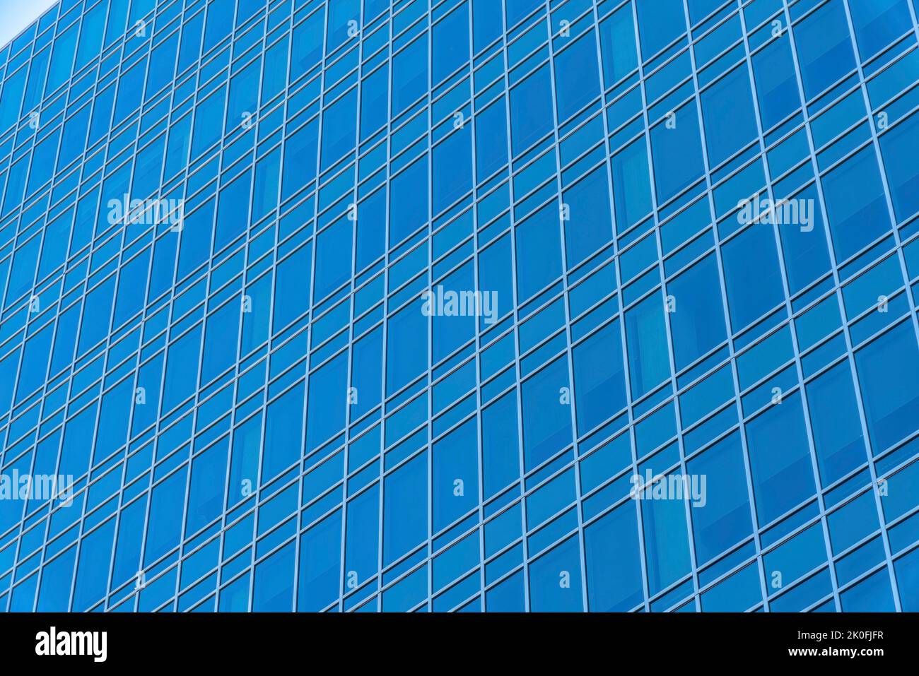 Blue building exterior with reflective glass facade in downtown Austin ...