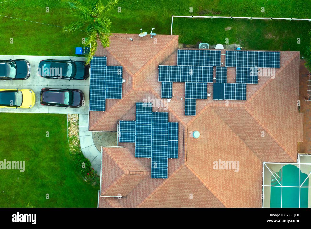Ordinary residential house in USA with rooftop covered with solar ...