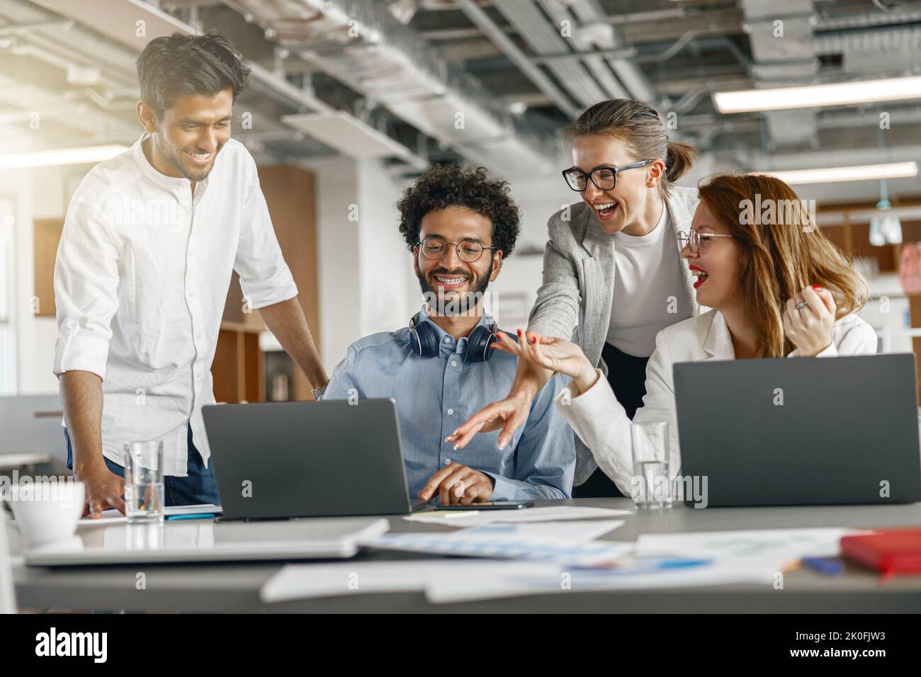 Busy coworkers cooperating and working together at office meeting ...
