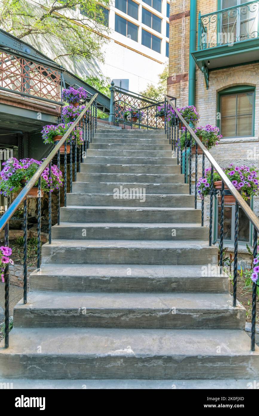 Outdoor staircase with steel railings going up a building on a ...