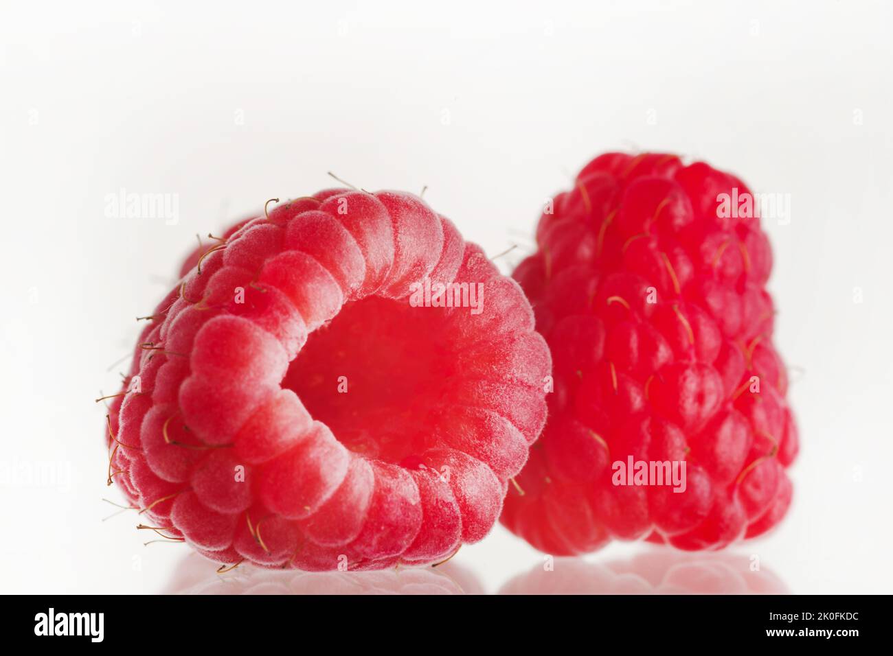 Macro shot. Ripe raspberries on a white background. Delicious sweet ...