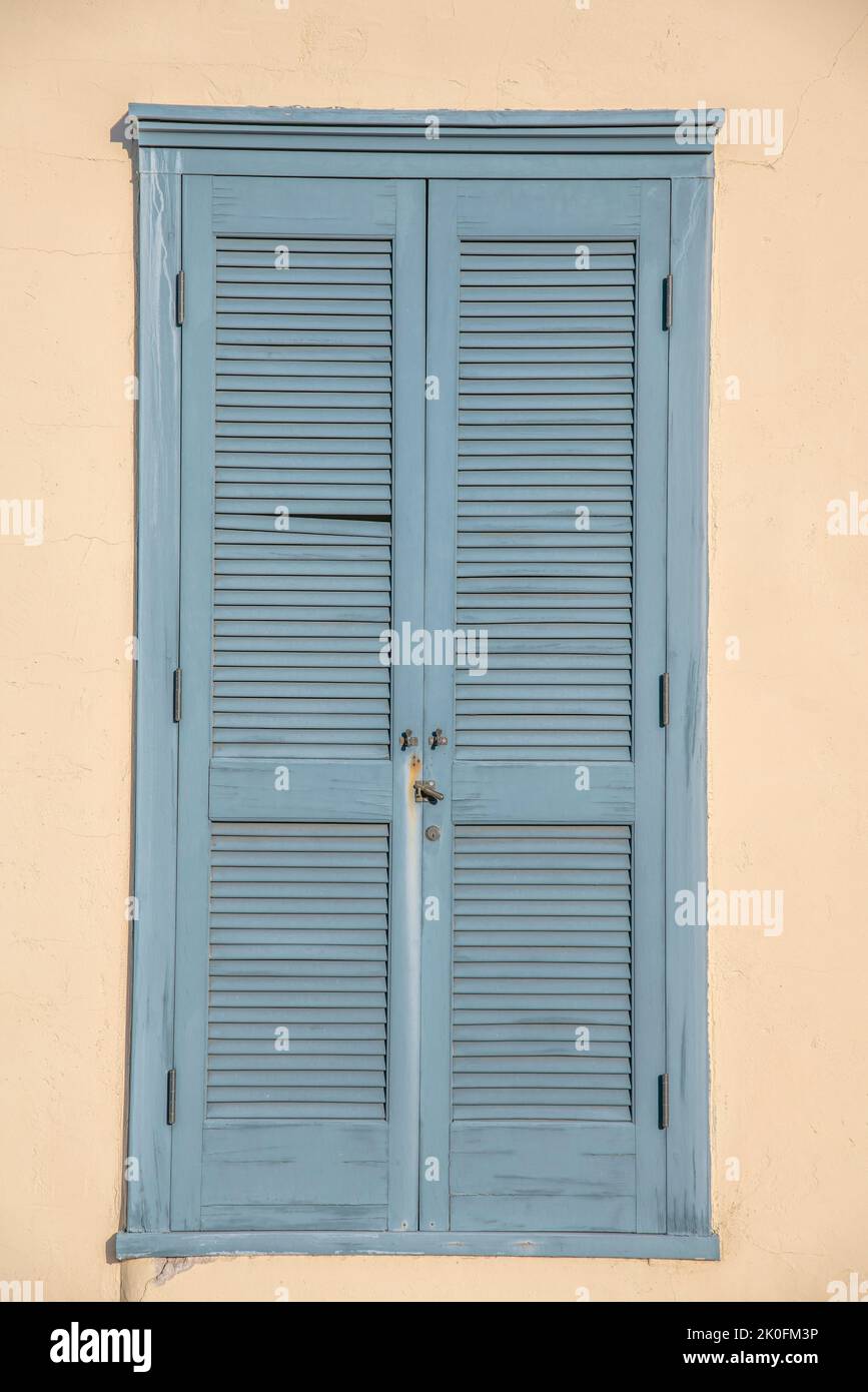 Light blue wooden window door against the beige wall at downtown Tucson ...