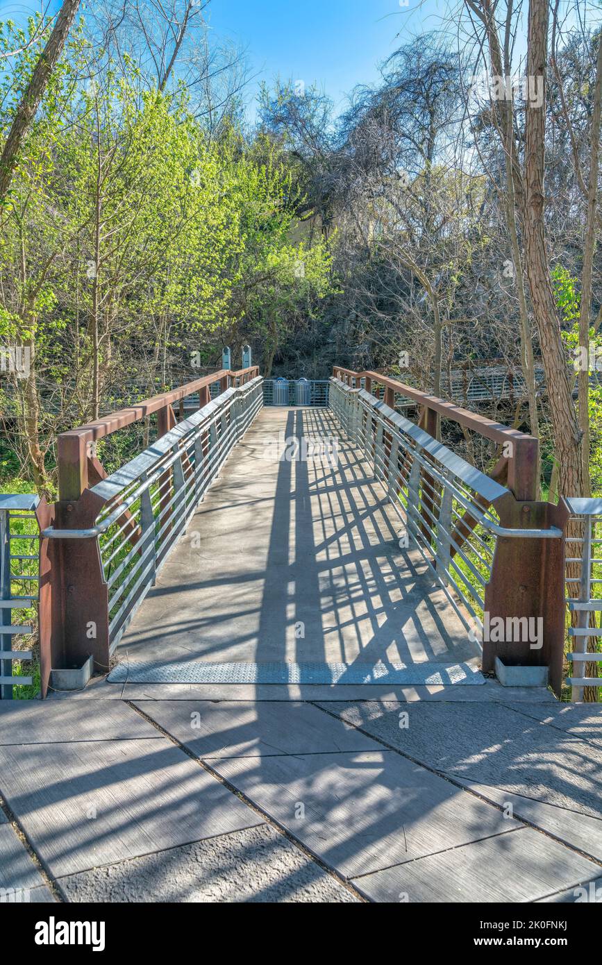 Austin, Texas- Boardwalk over the wild plants and trees. Bike path and ...