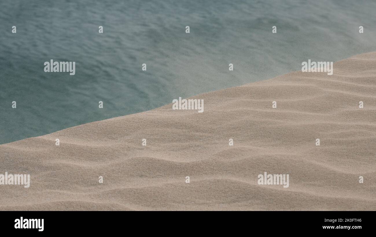 Sands flying due to wind from the sand dune Stock Photo - Alamy