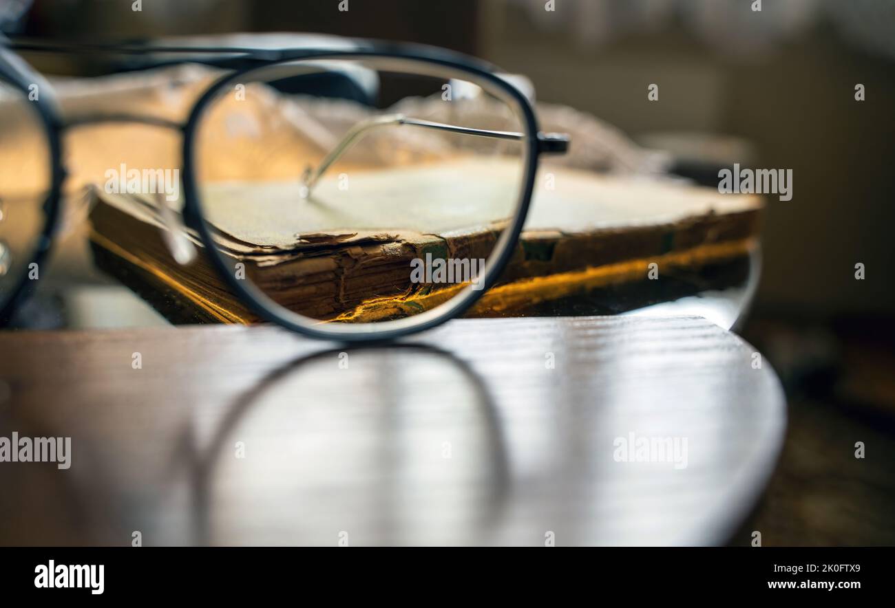 Time and knowledge concept, An eye glasses or spectacles kept in front ...