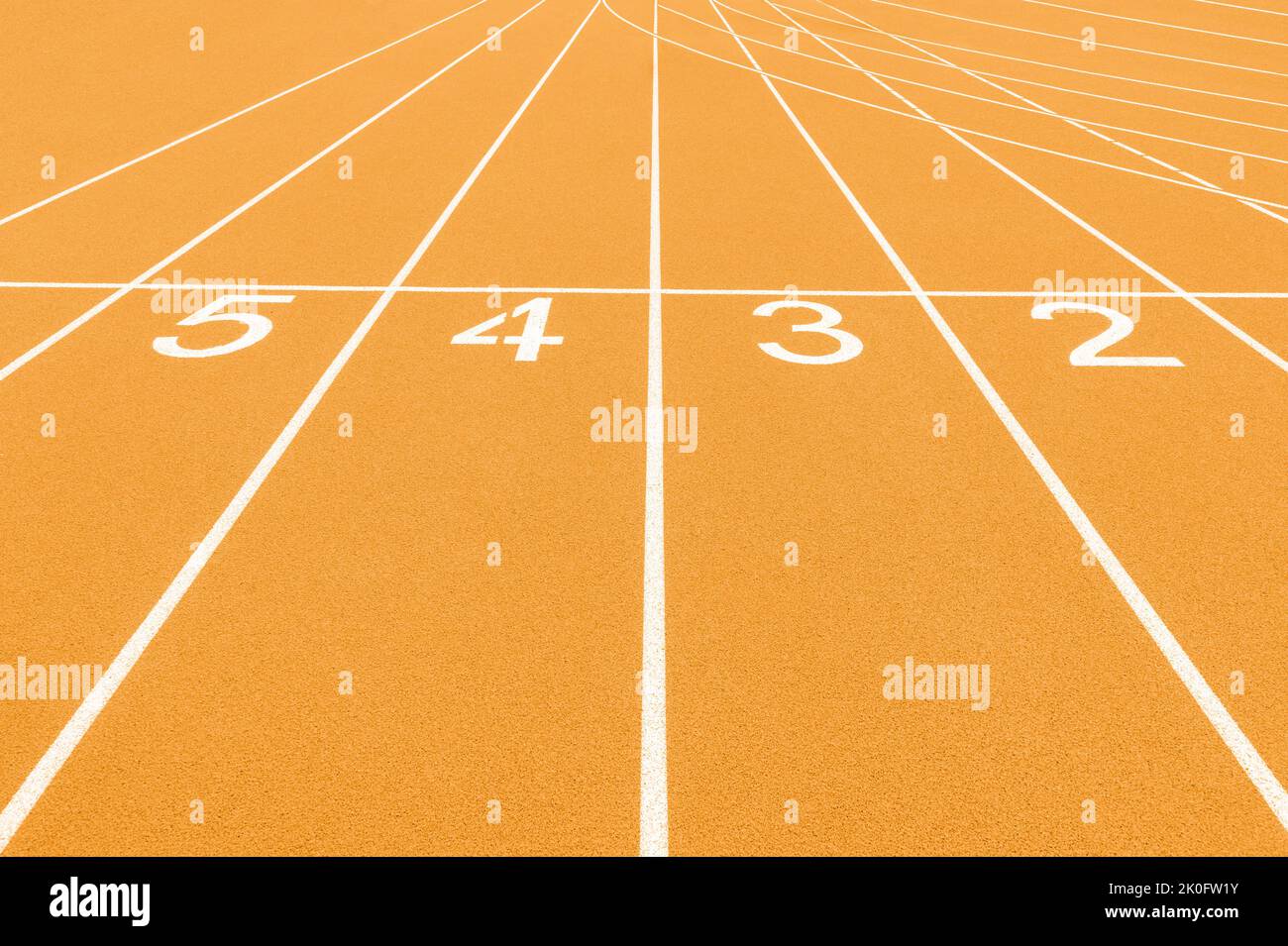 Yellow track and field lanes and numbers. Running lanes at a track and ...