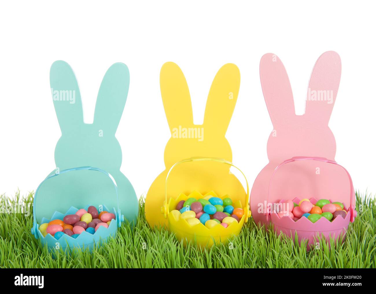 Three colorful wooden Easter Bunny Silhouettes in blue, yellow and pink ...