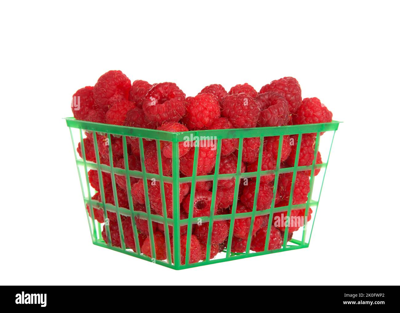 Green open weave plastic pint sized basket full of fresh ripe red ...