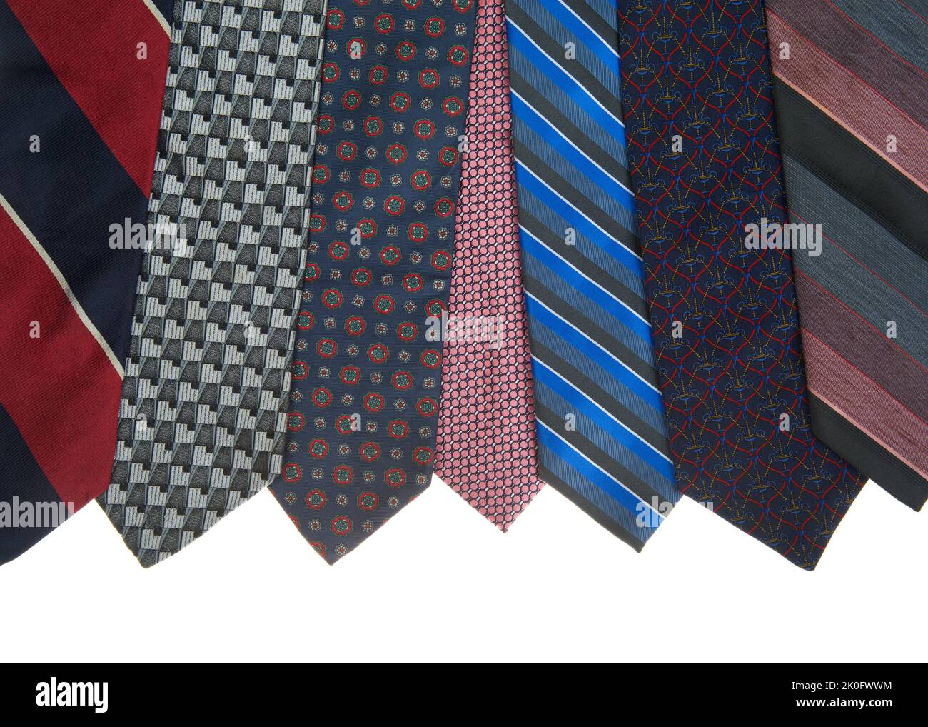 Variety of neck ties lined up in a row, striped and patterned. Isolated ...