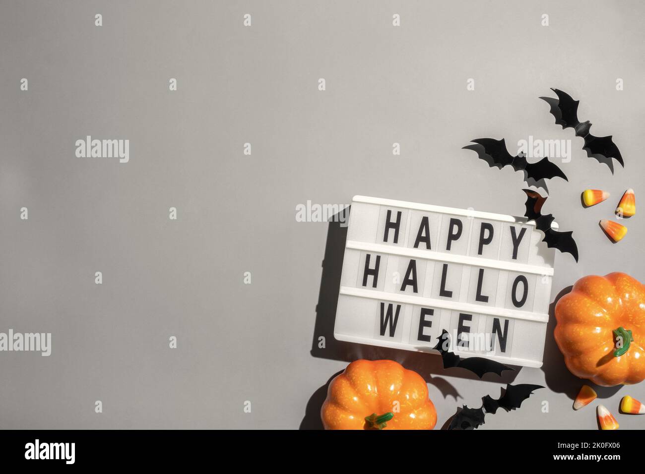 Happy Halloween lightbox sign board with pumpkin, bats and candy on a ...