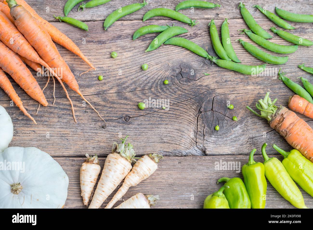Vegetables on the wooden table. Top view with copy space. Types of ...
