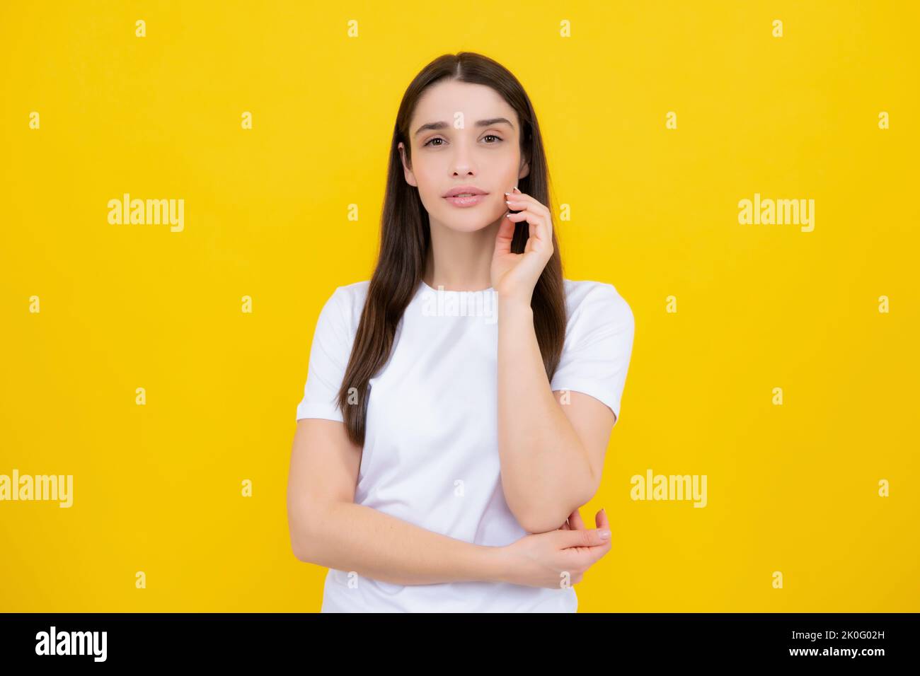 Pretty joyfully female model looking with satisfaction. Studio portrait ...