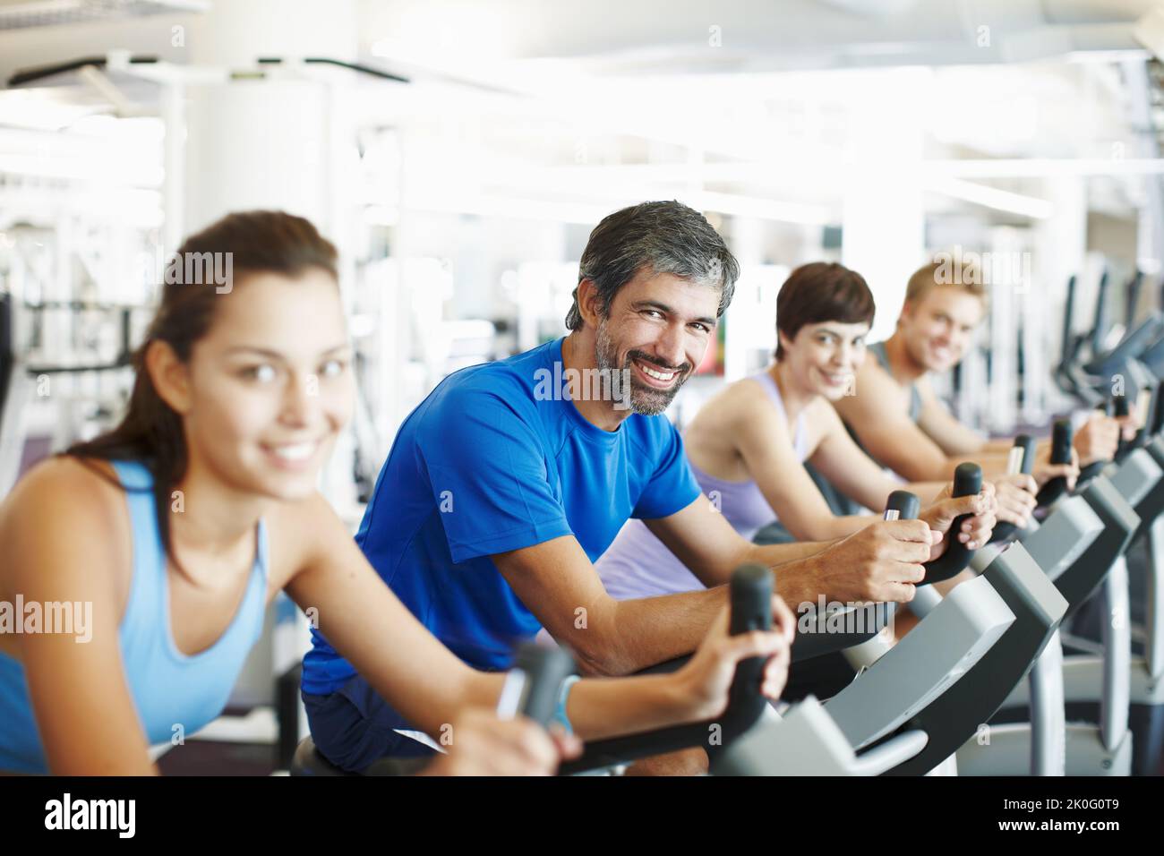 Woman on gym bike starting hi-res stock photography and images - Alamy