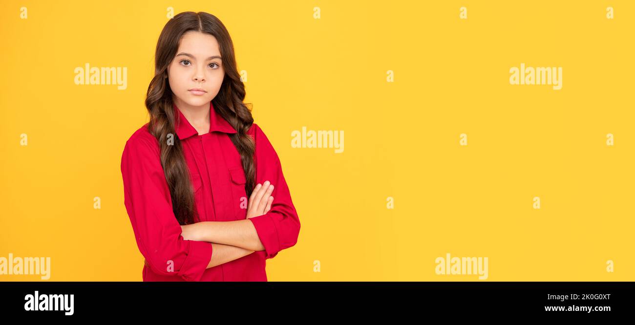 serious child girl with crossed hands looking confident, confidence ...