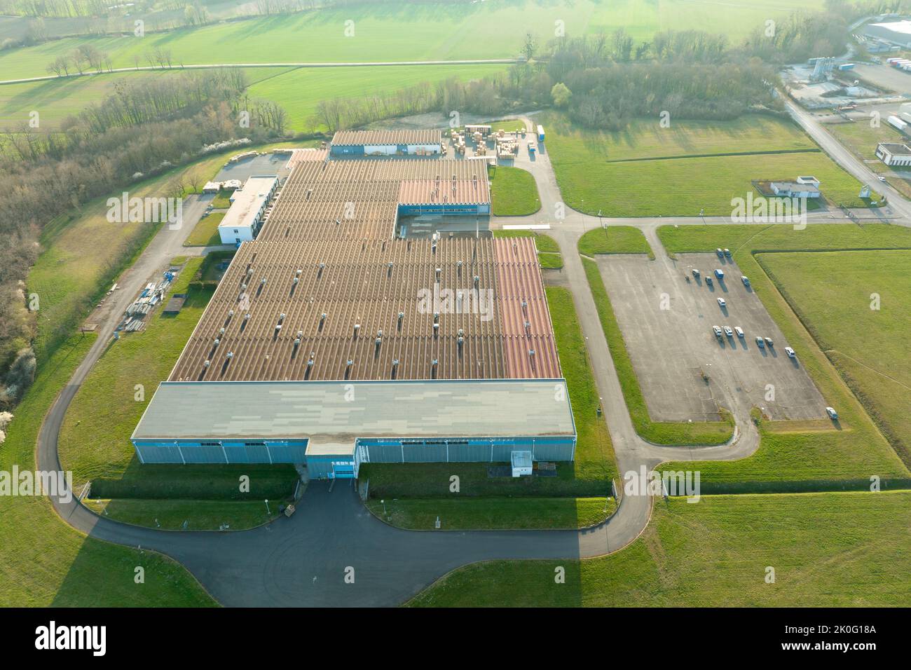 Aerial view of modern factory structure for production and distribution ...