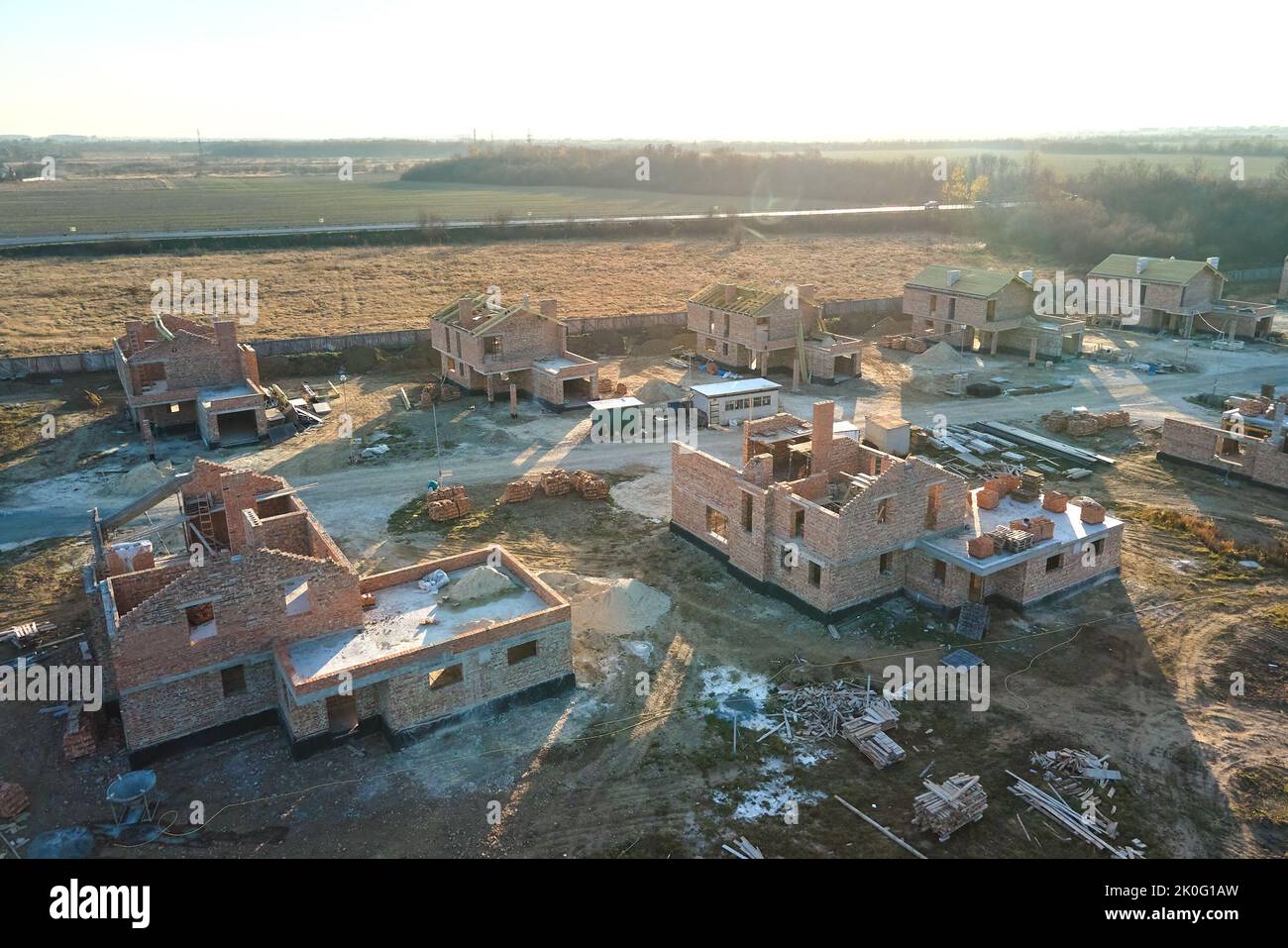 Aerial view of new homes with brick framework walls under construction ...